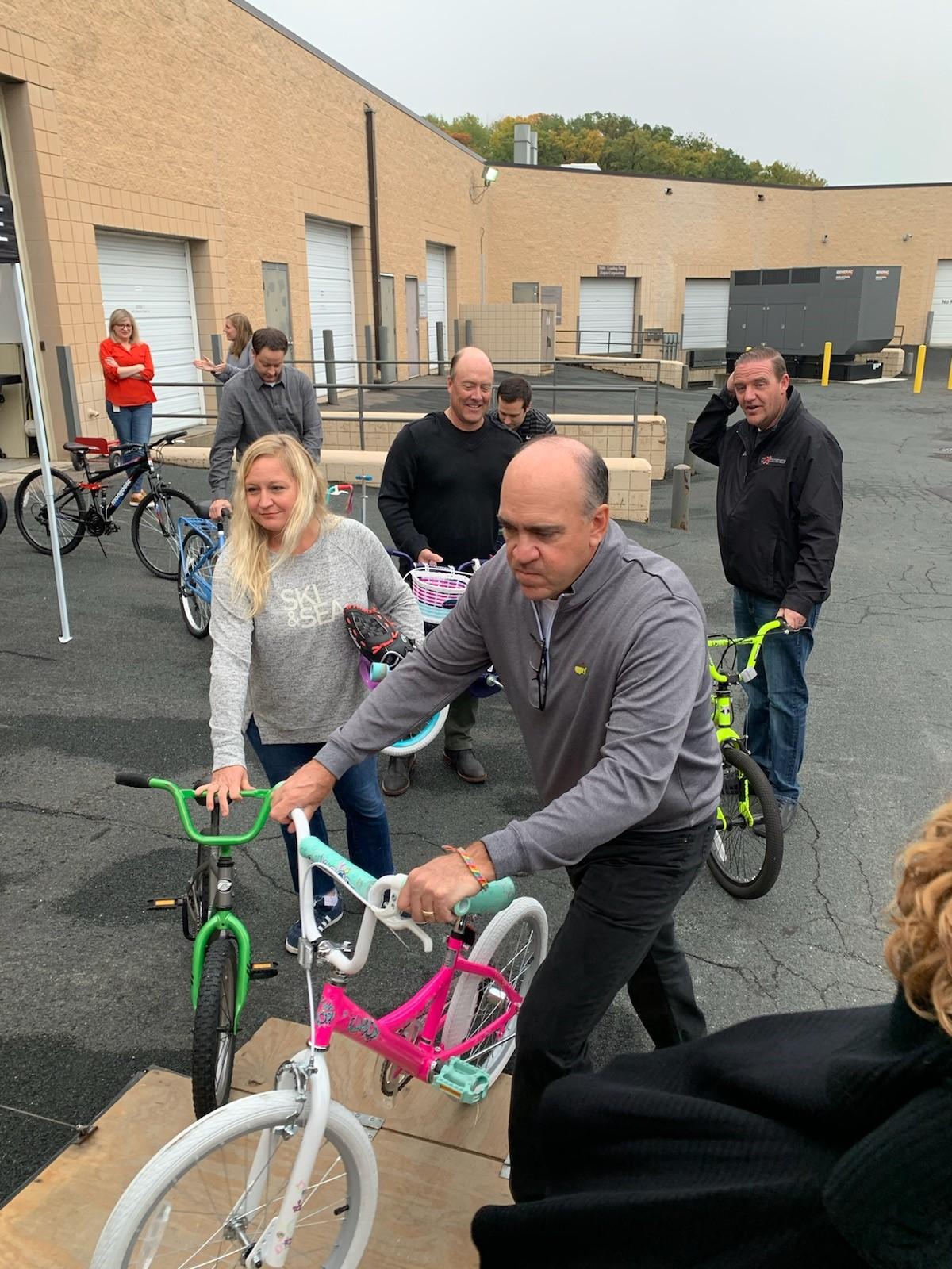 Donating Bikes and Sharing Love - Signature | Strategic, Sales, Solutions